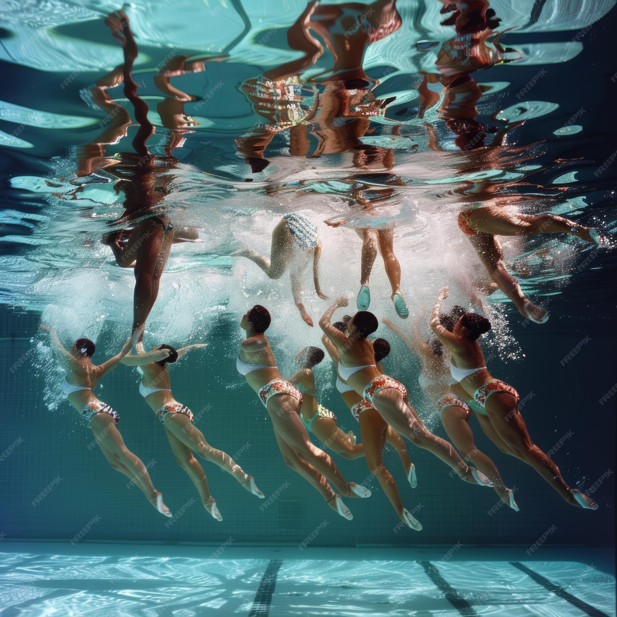 Underwater synchronized swimmers perform a routine | Premium AI ... Underwater synchronized swimmers perform a routine | Premium AI ...