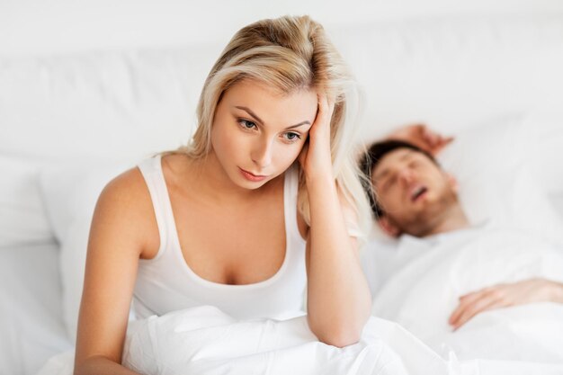 Premium Photo | Unhappy woman in bed with snoring sleeping man Premium Photo | Unhappy woman in bed with snoring sleeping man