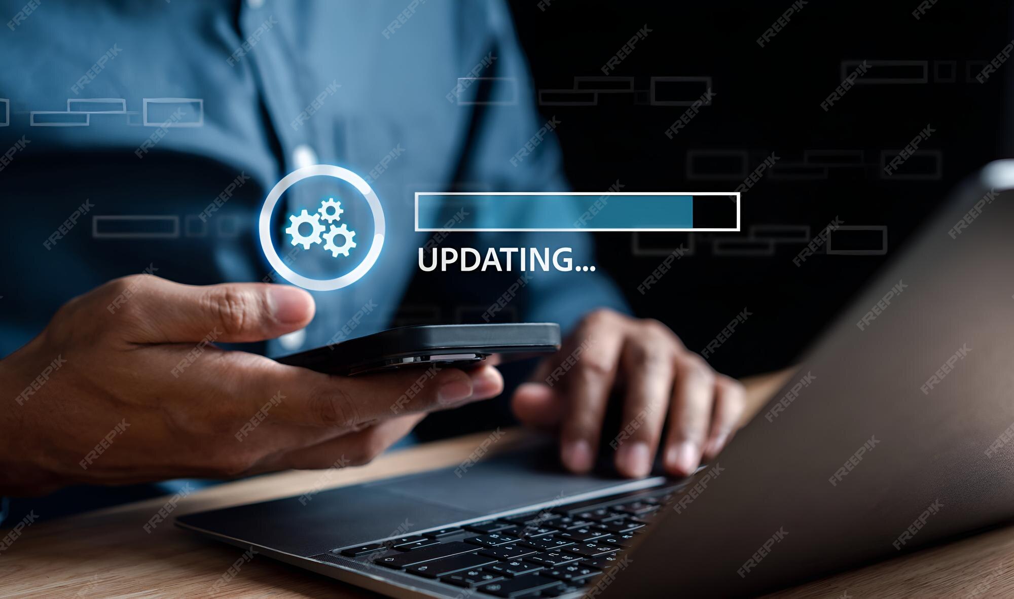 Premium Photo | Update software system in computer man using smartphone upgrade program business ...