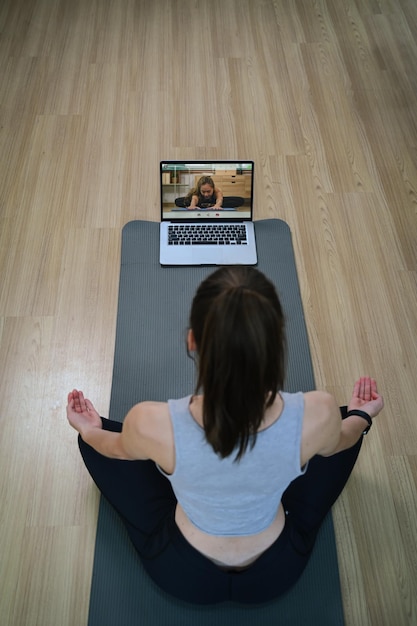 Premium Photo Above View Of Young Woman Doing Yoga Exercise And