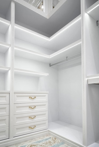 Premium Photo White Corner Wardrobe Section With Empty Rack And Led