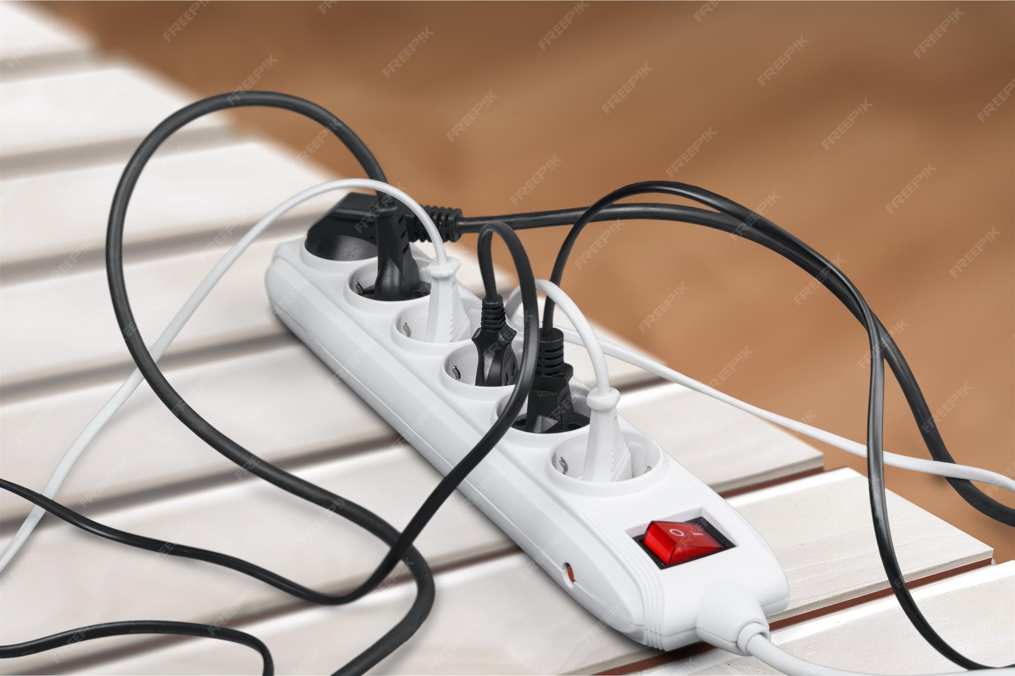 Premium Photo | White multiple socket and plugs Premium Photo | White multiple socket and plugs