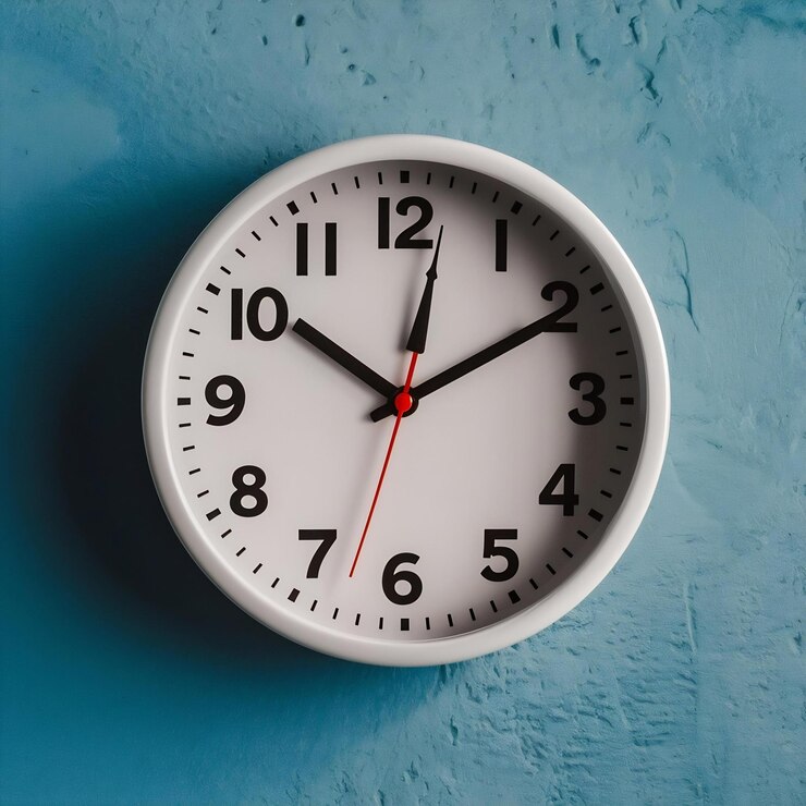 White round office clock showing nine oclock isolated on white ... White round office clock showing nine oclock isolated on white ...