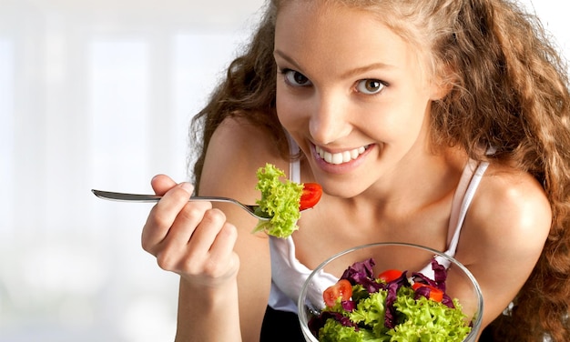 Premium Photo Woman Eating Salad