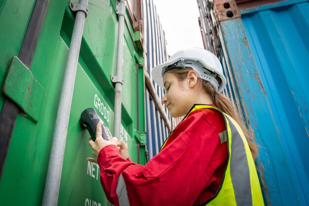 Premium Photo Woman Foreman And Operator Using Credit Card Swipe Machine For Checking Code Of