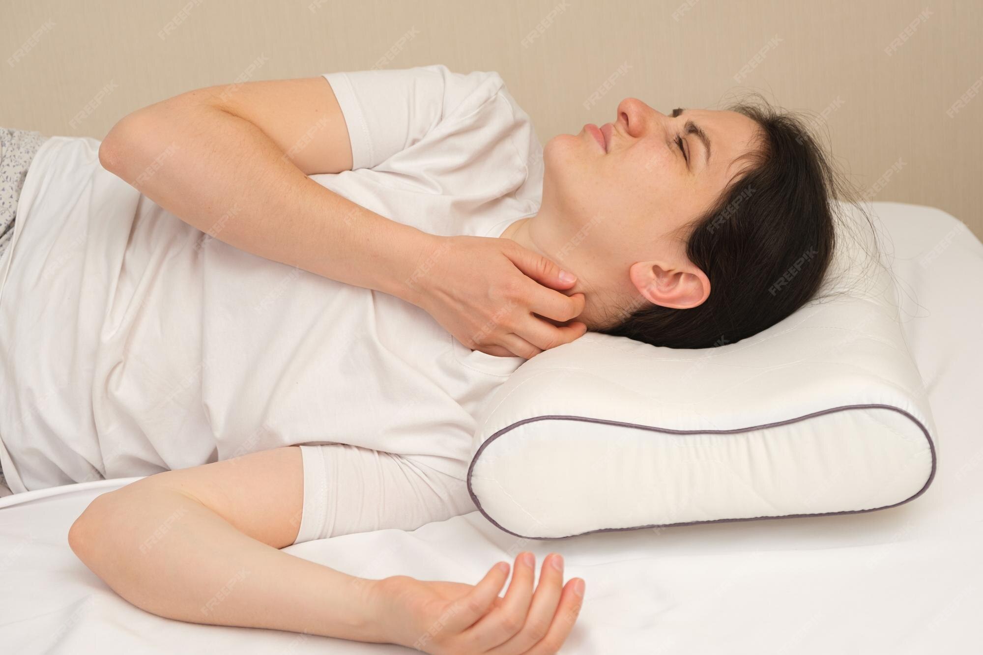 Premium Photo A Woman Has A Sore Neck After Sleeping On The Pillow