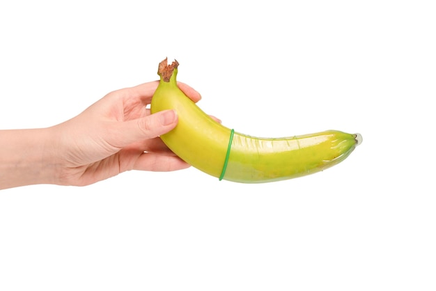Premium Photo Woman Put On A Condom On A Banana Isolated On White