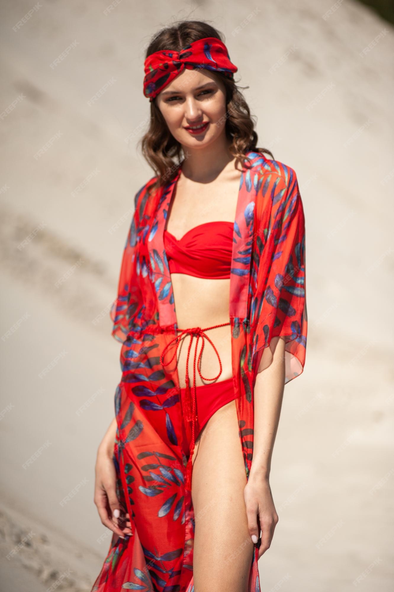 Premium Photo A Woman In A Red Bikini And A Red Bikini Stands In The Sand