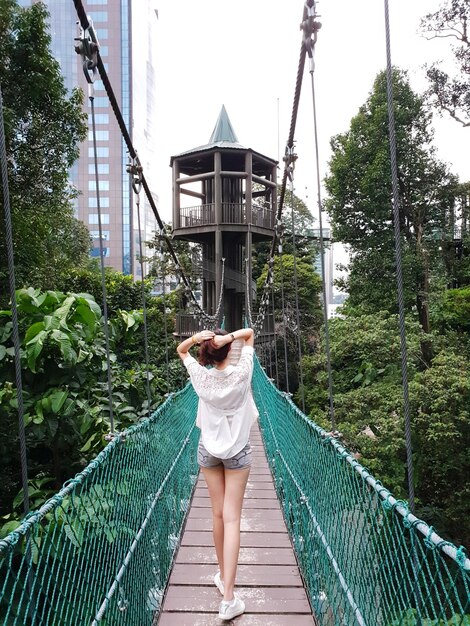 Premium Photo Woman Standing On Bridge