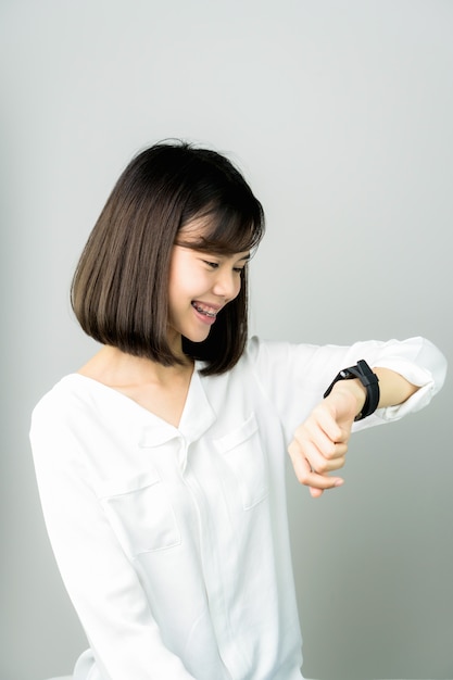 Premium Photo Woman Using A Digital Clock In The Display And Technology Advances In Communication