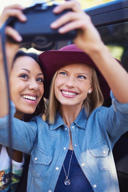 Premium Photo Women Friends And Selfie Photo With A Camera On A Holiday Outside For A Road