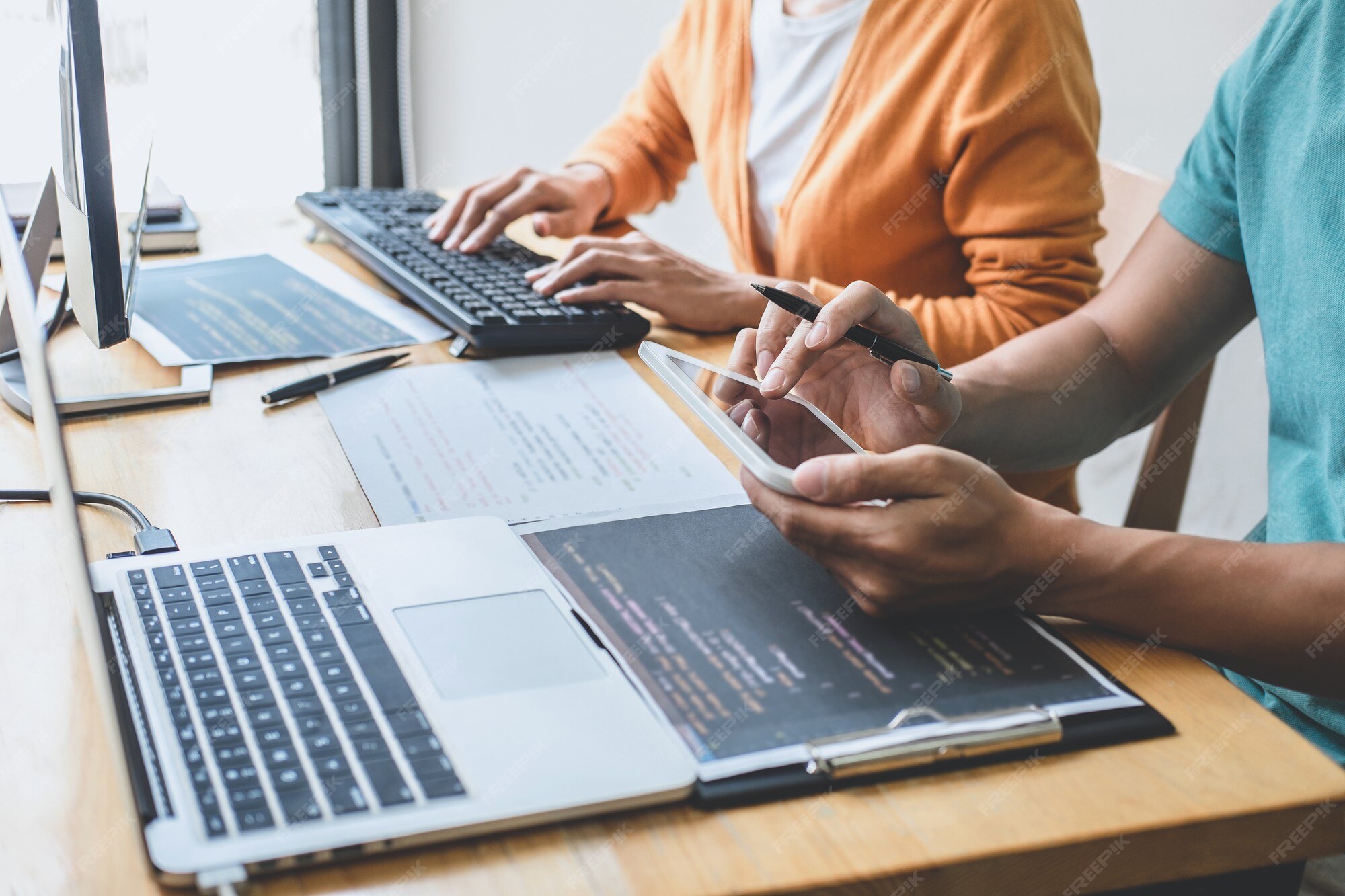 Premium Photo | Writing codes and typing data code technology, Programmer cooperating working on ...