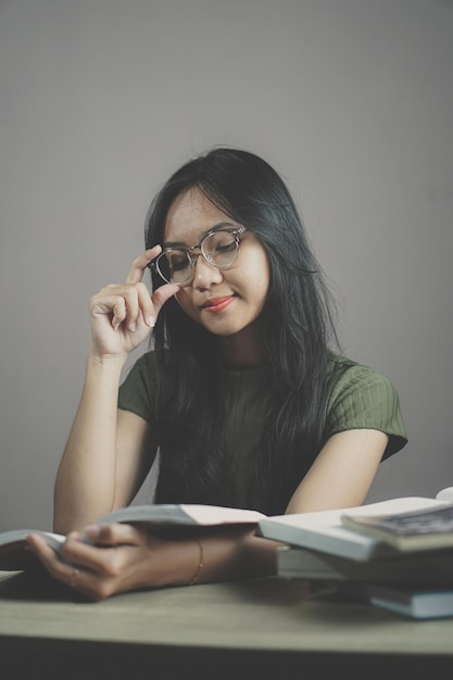 Premium Photo | Young asian women reading a book Premium Photo | Young asian women reading a book