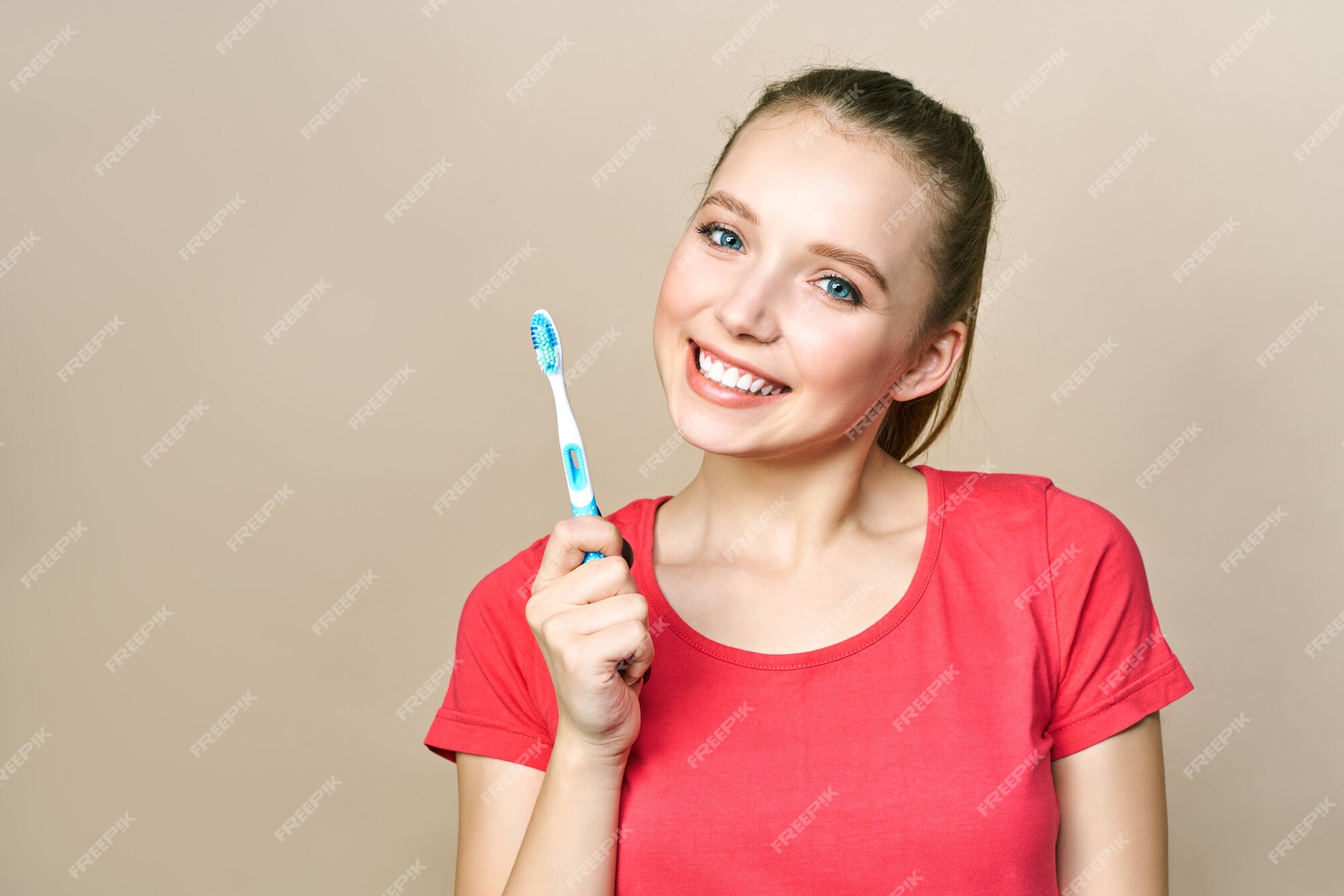 Premium Photo Young Beautiful Woman Is Engaged In Cleaning Teeth