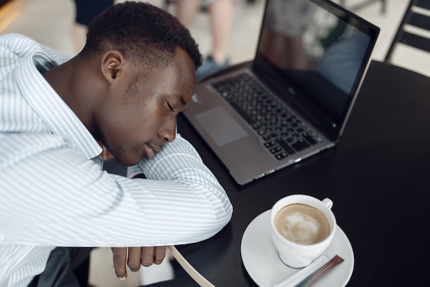 Premium Photo Young Ebony Businessman With Laptop Sleeping In Office