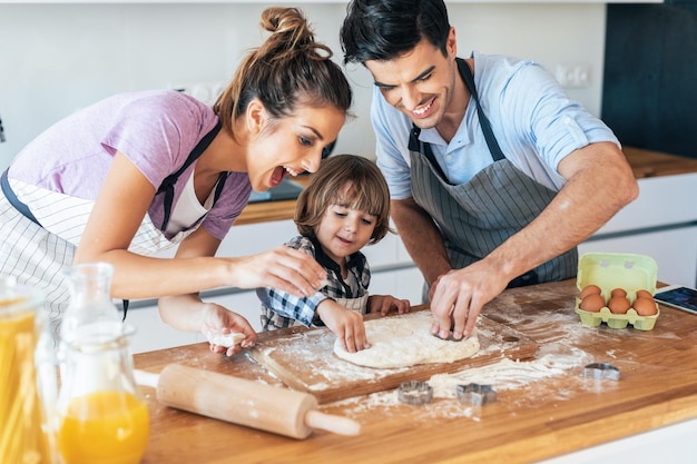 Premium Photo | Young family playing scrabble word game at table Premium Photo | Young family playing scrabble word game at table