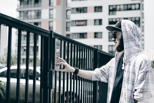 Premium Photo | Young man entering password in security system on gate Premium Photo | Young man entering password in security system on gate