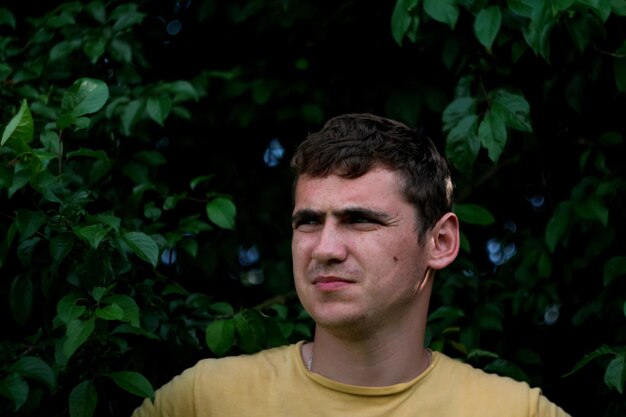 Premium Photo | Young man hiding in a bush defocus portrait young man ... Premium Photo | Young man hiding in a bush defocus portrait young man ...