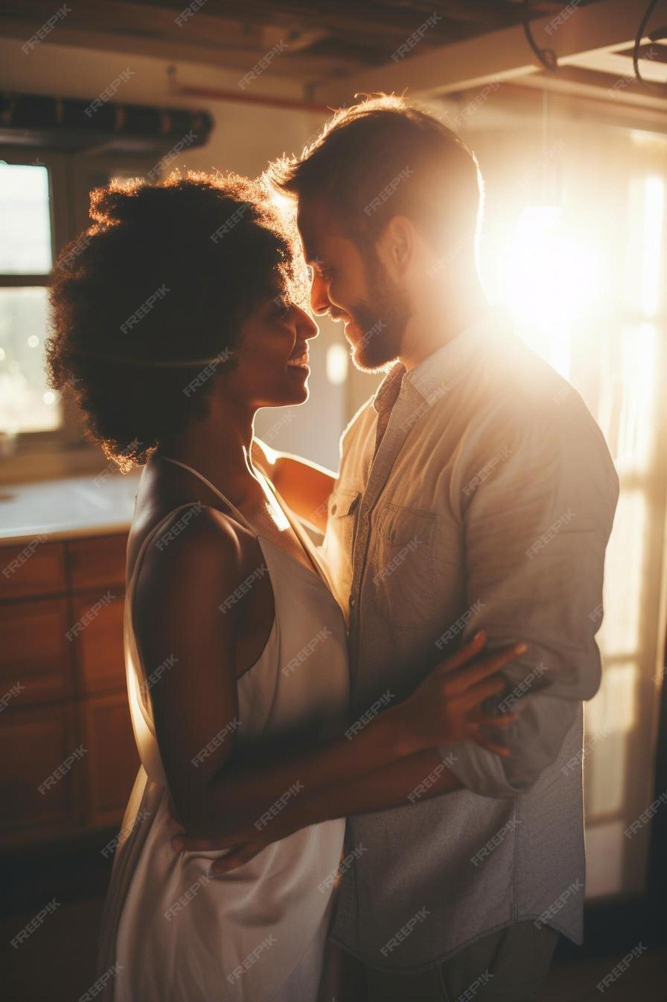 Premium Photo Young Multiracial Couple Embracing In Their First Home