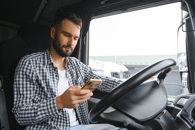 Premium Photo | Young professional driver communicating over mobile ... Premium Photo | Young professional driver communicating over mobile ...