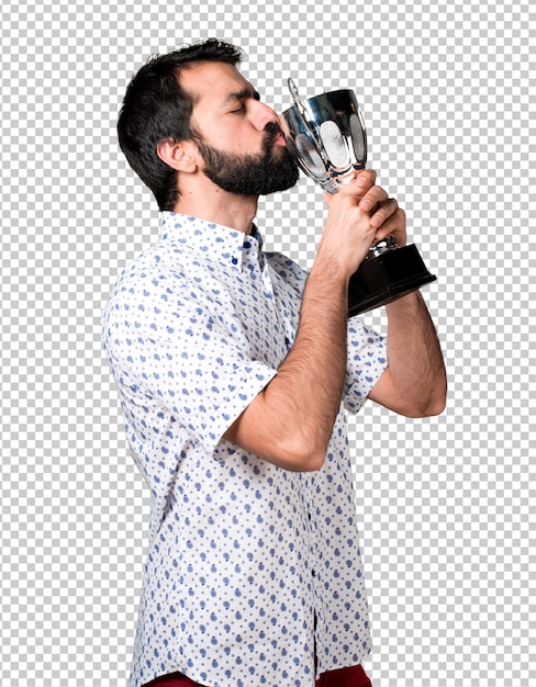 Premium Psd Handsome Brunette Man With Beard Holding A Trophy