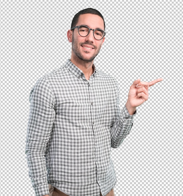 Premium PSD | Happy young man pointing Premium PSD | Happy young man pointing